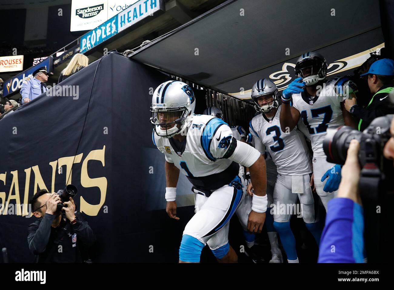 Carolina Panthers quarterback Cam Newton (1) runs onto the field for ...