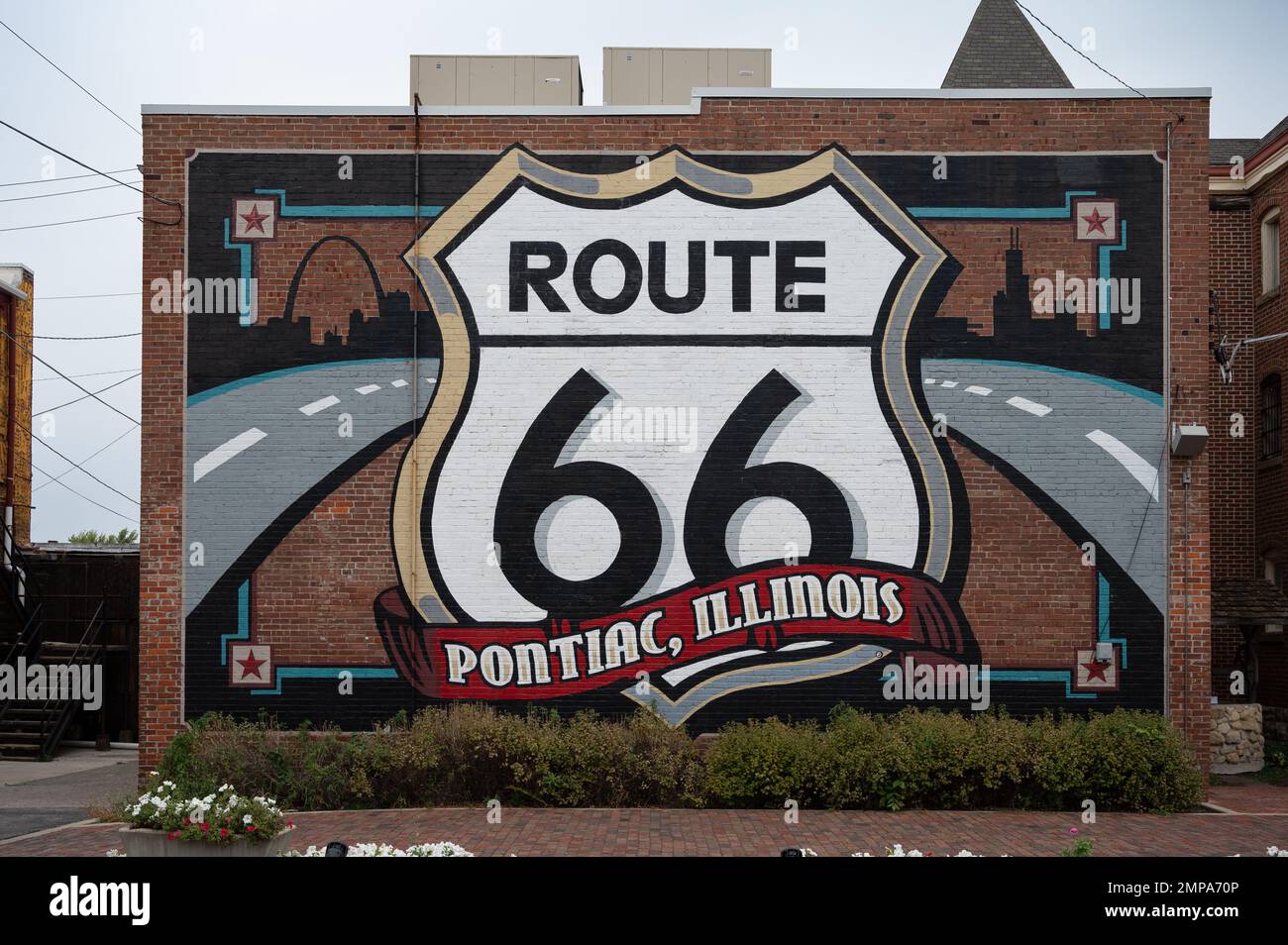 A close-up shot of the Route 66 mural on an old exposed brick building ...