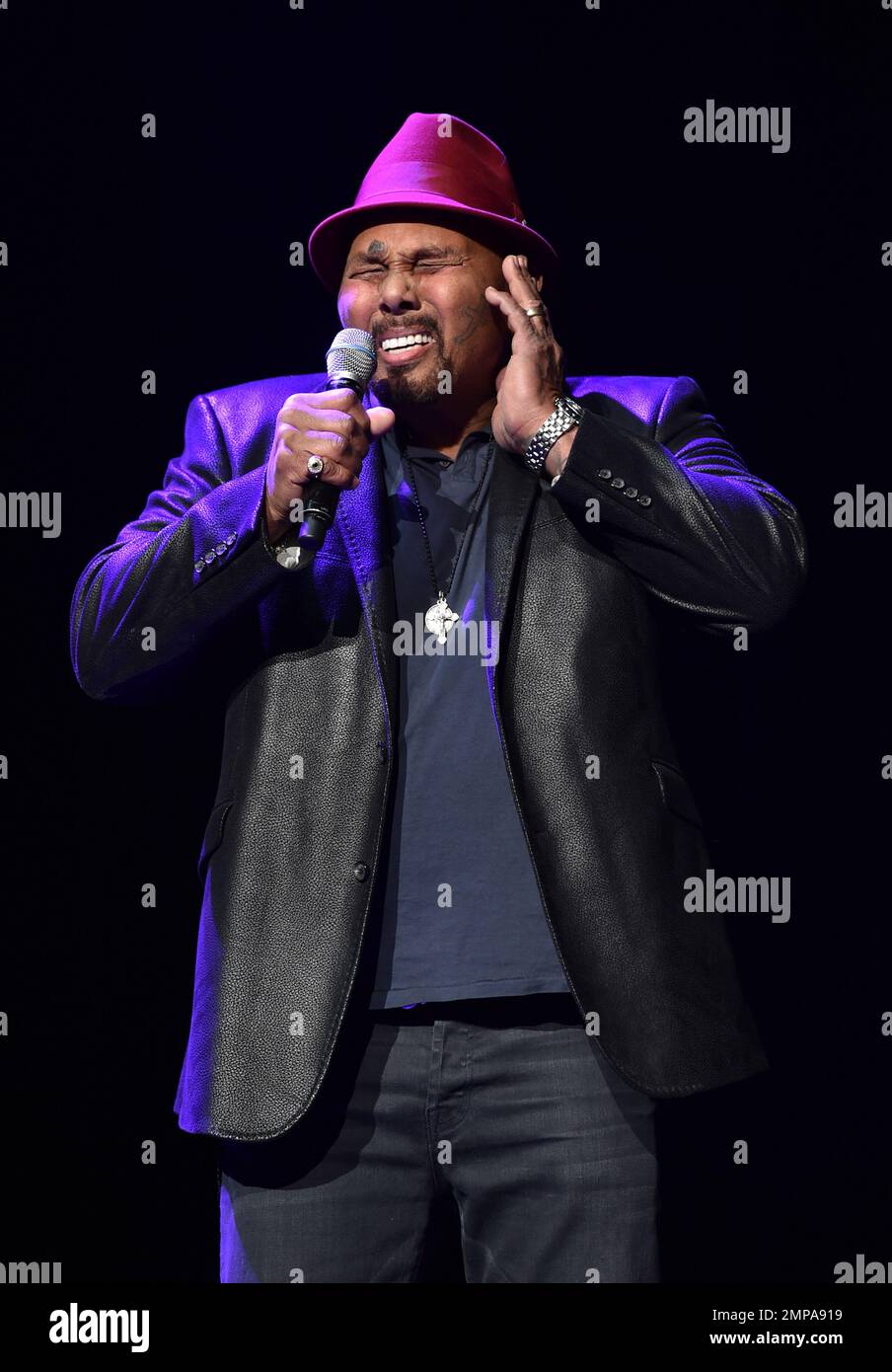 Singer Aaron Neville performs during A Concert For Island Relief at ...
