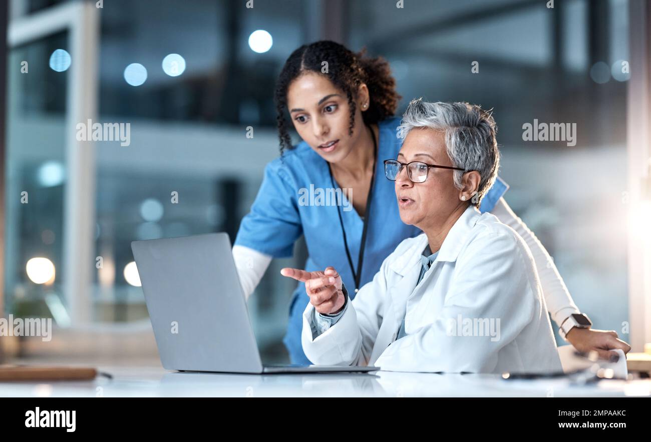 Doctors, nurse or laptop in night healthcare, planning research or surgery teamwork in wellness ...