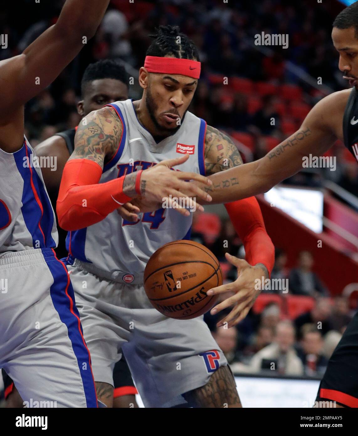 Houston Rockets forward Trevor Ariza, right, reaches in on Detroit ...