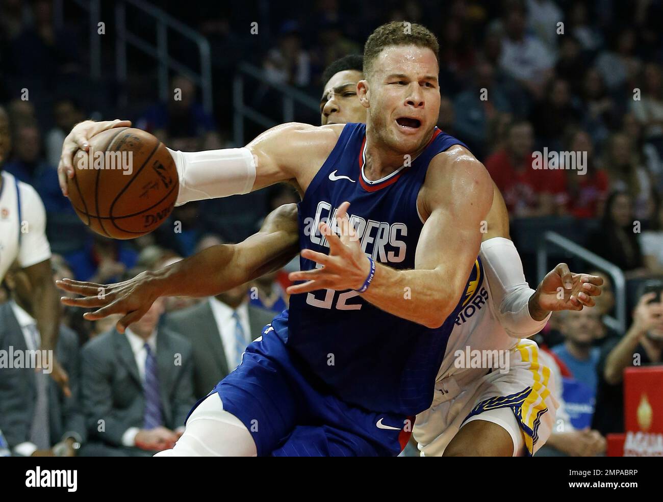 Los Angeles Clippers forward Blake Griffin, right, drives to the basket ...
