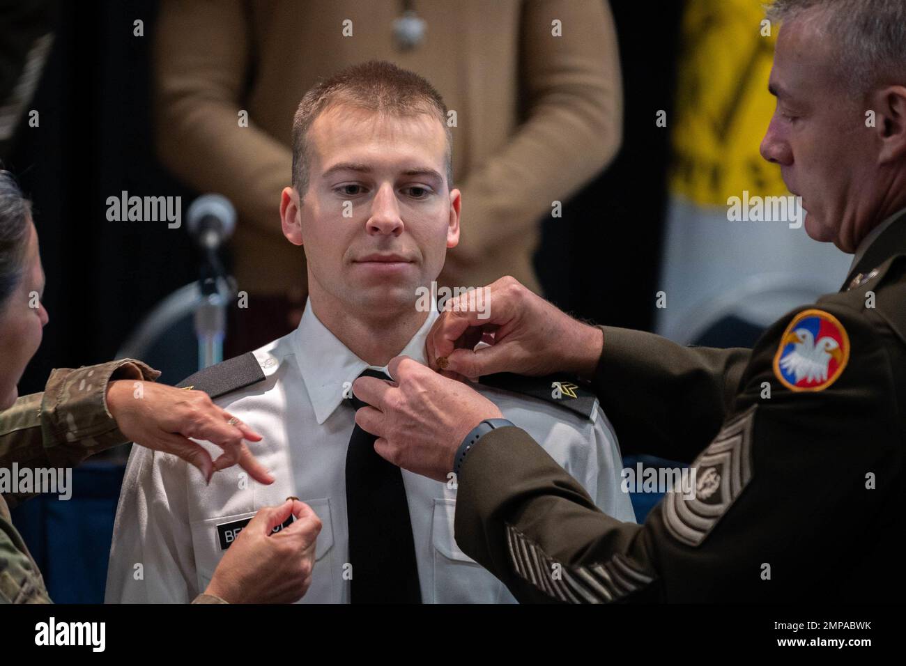 Army Reserve Spc. Brady A. Benedict (center), a military policeman ...