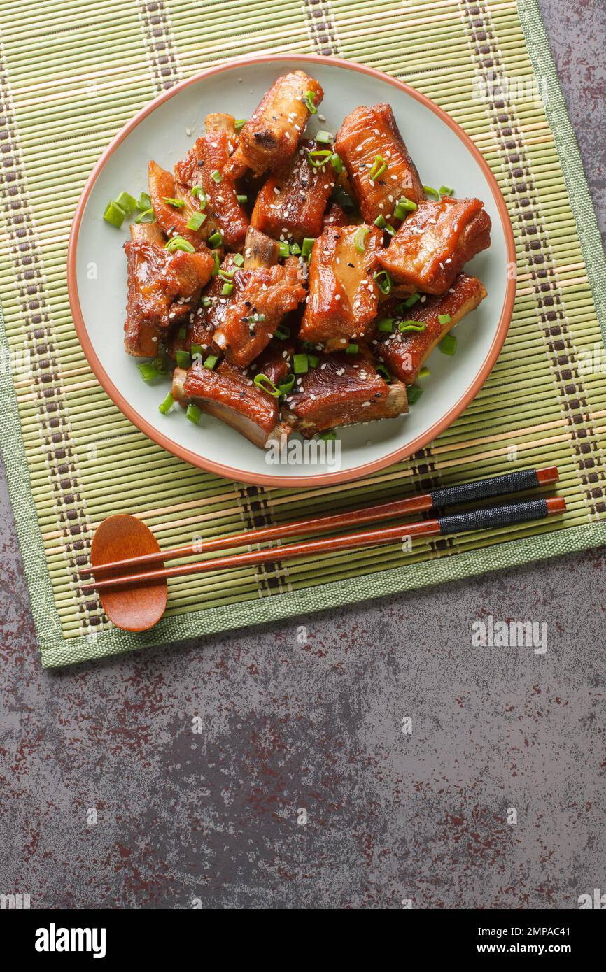 Fried pork short ribs in sweet and sour sauce in Asian style close-up ...
