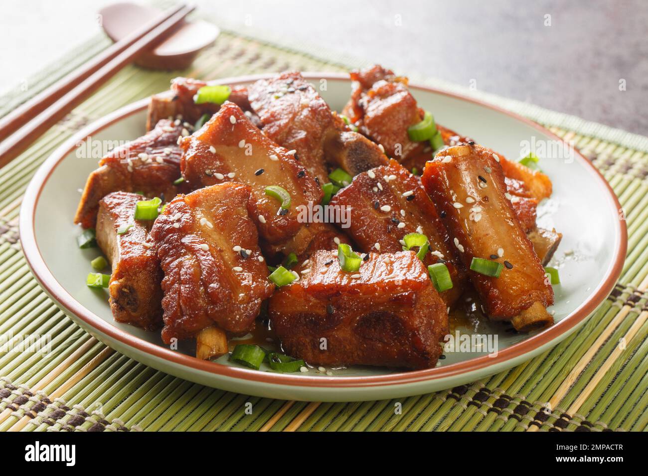 Glazed pork short ribs in sweet and sour sauce in Asian style close-up ...