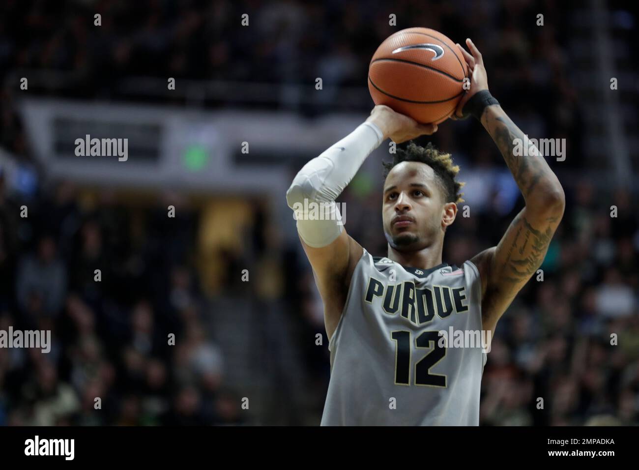 Purdue forward Vincent Edwards (12) shoots a free throw against ...