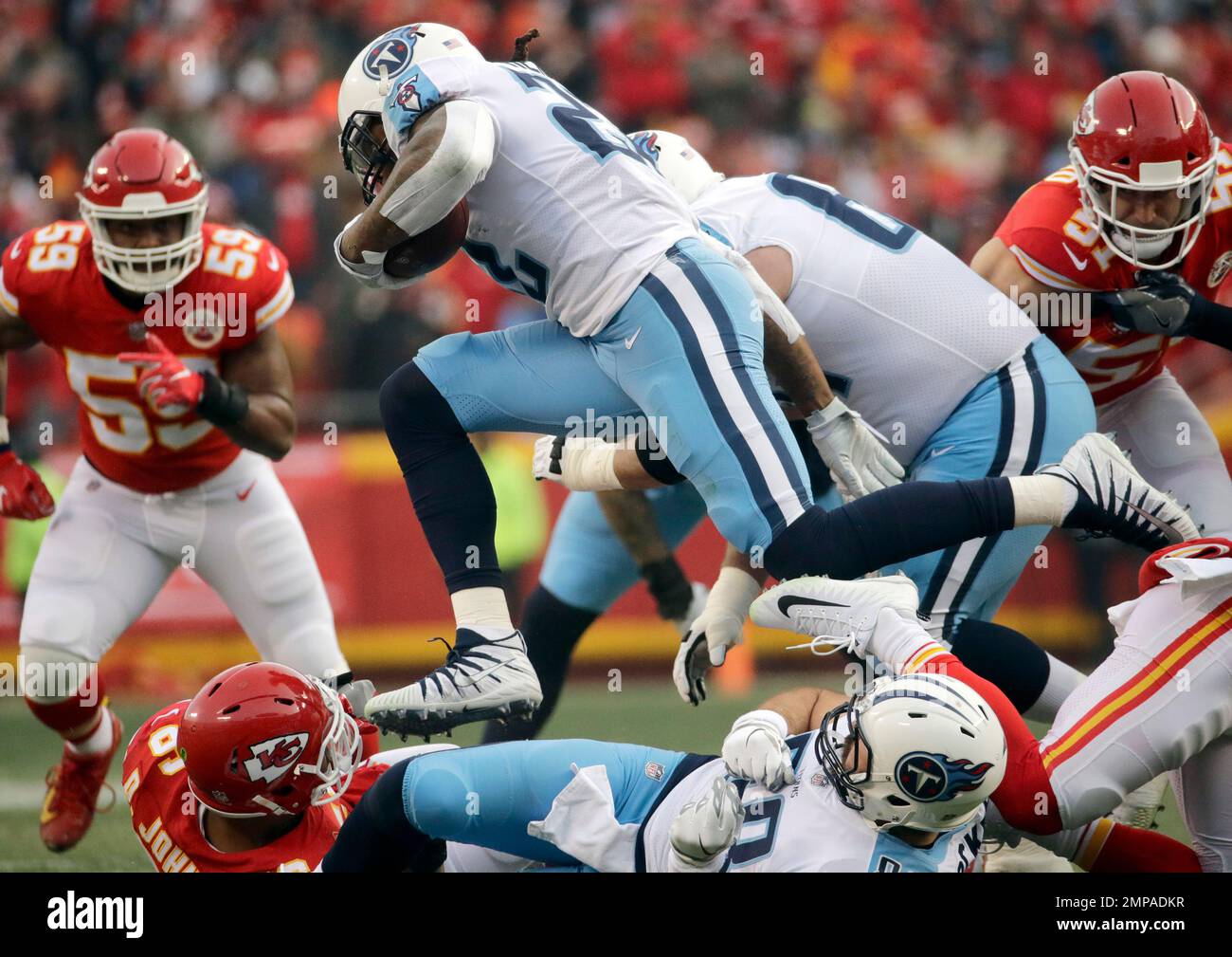 Tennessee Titans running back Derrick Henry (22) carries the ball over ...