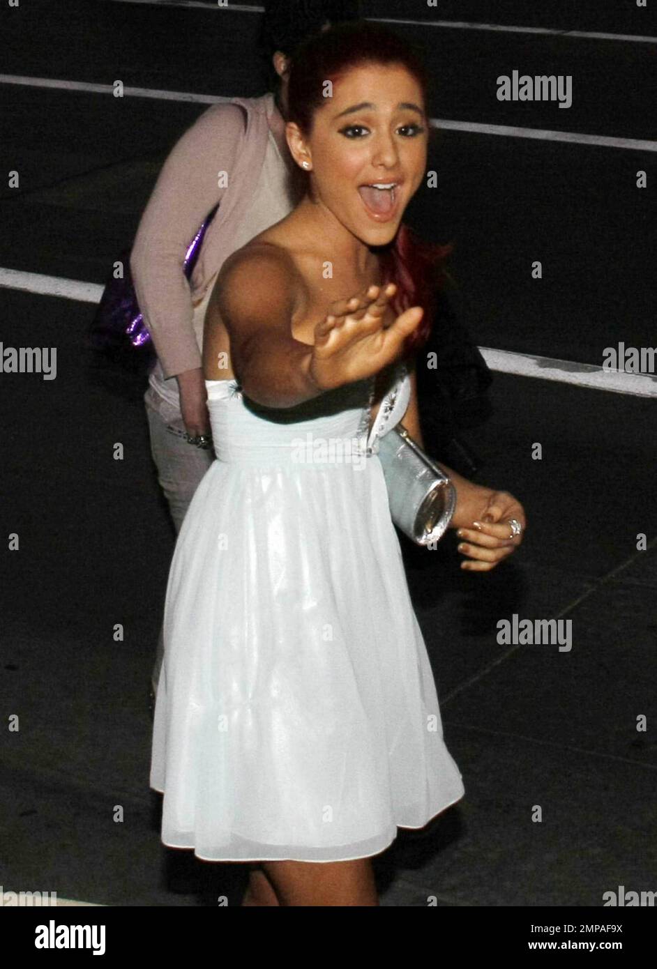 Showing off her bright red hair actress Ariana Grande of the ...