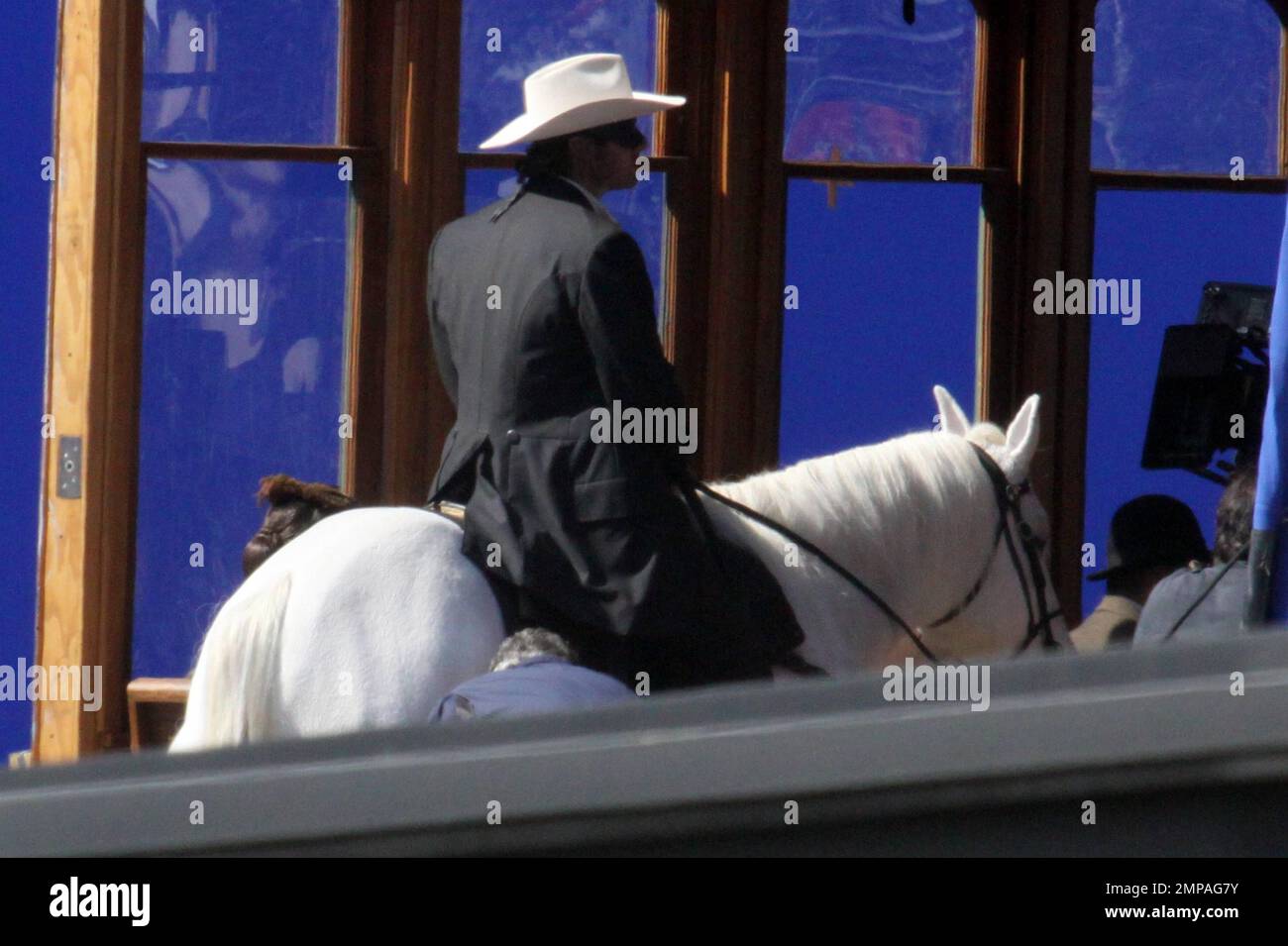Armie Hammer, in character as the Lone Ranger, is seen riding a horse ...