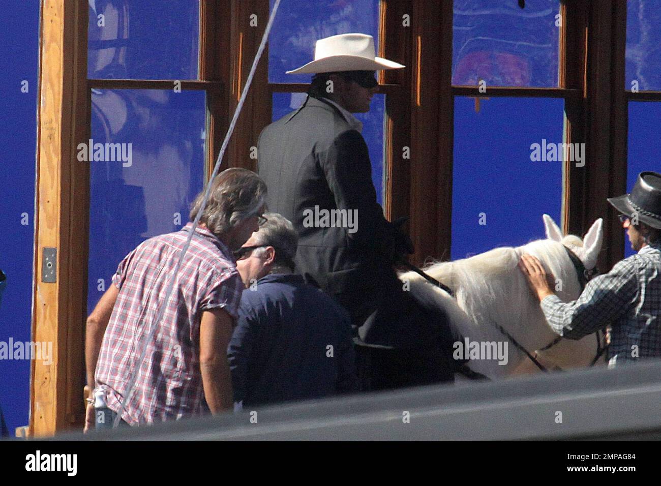 Armie Hammer, in character as the Lone Ranger, is seen riding a horse ...