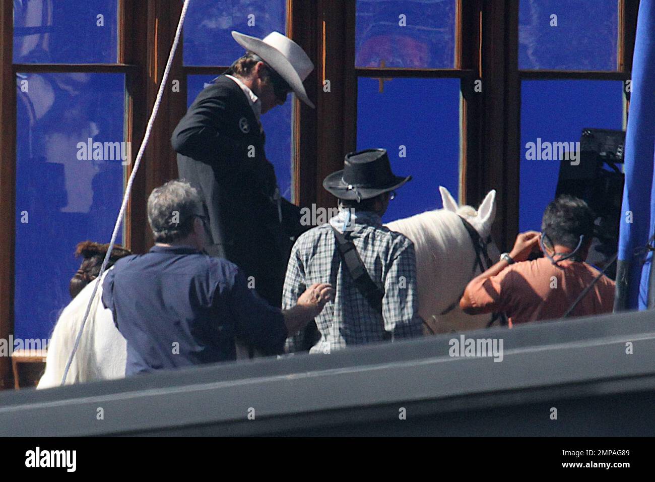 Armie Hammer, in character as the Lone Ranger, is seen riding a horse ...