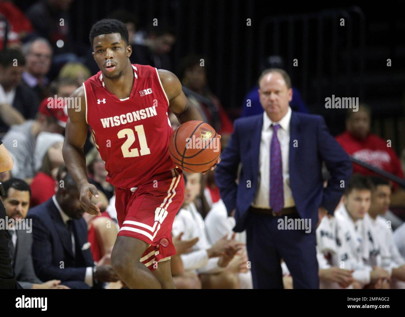 As head coach Greg Gard watches, Wisconsin's Khalil Iverson (21 ...