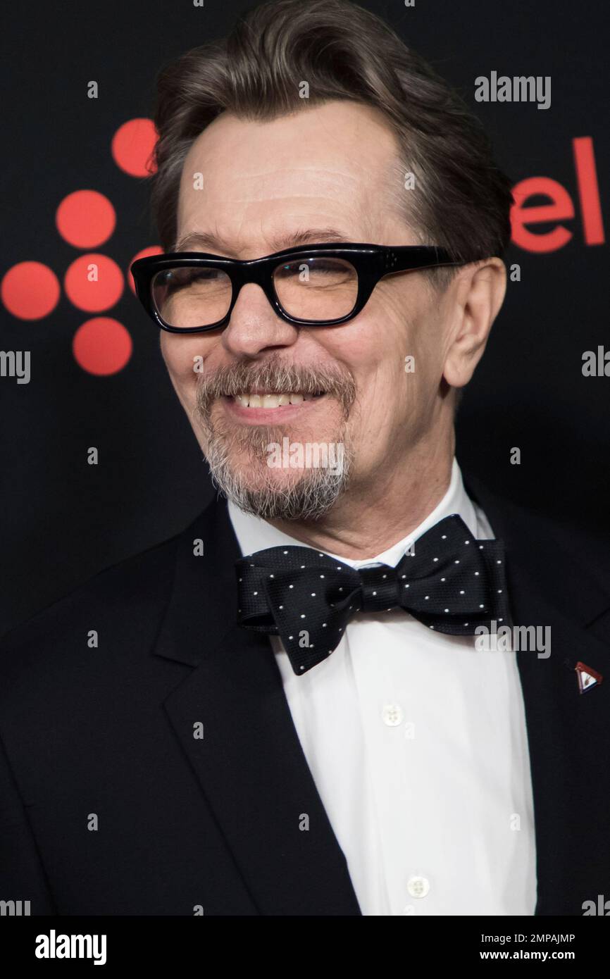 Gary Oldman poses for photographers upon arrival at the 7th annual ...