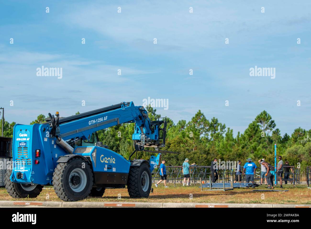 Airmen assigned to the 325th Fighter Wing work to set up a concert ...