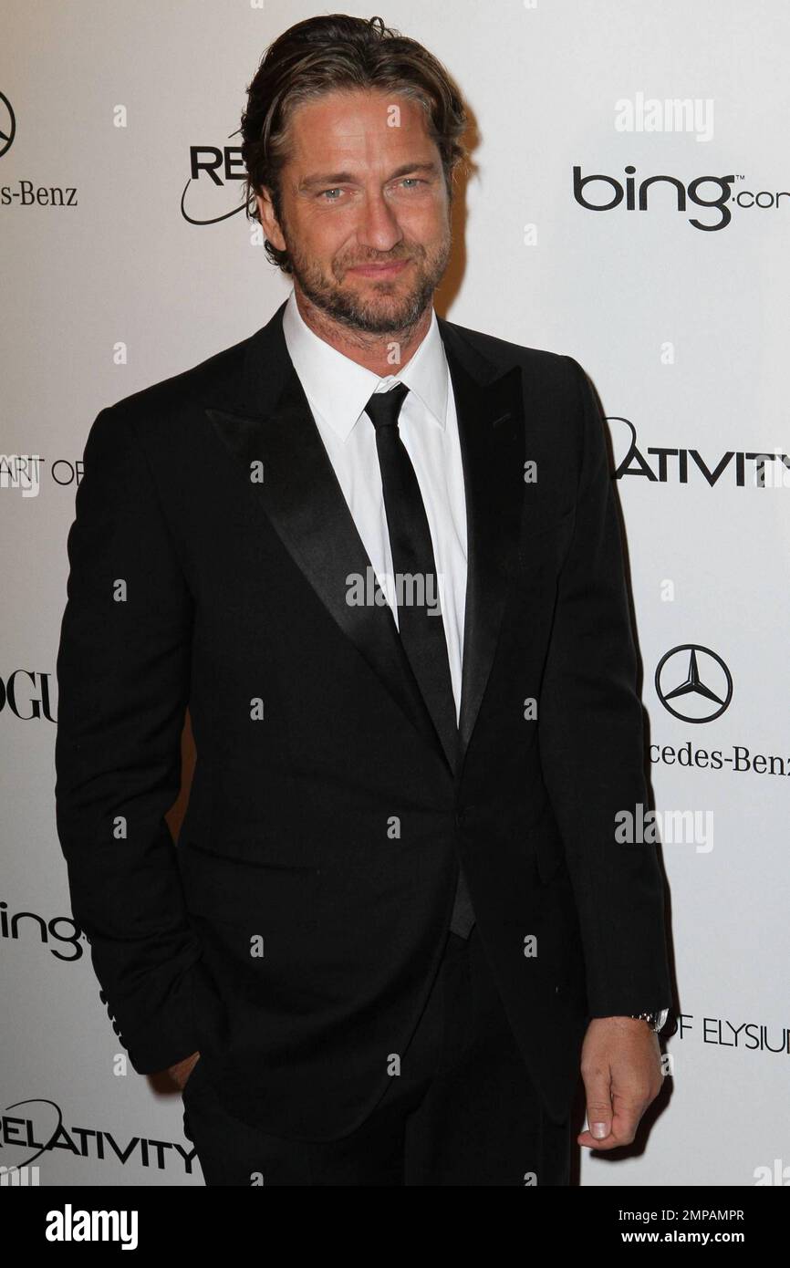 Showing off slicked back hair and a bit of a goatee a tanned and ...