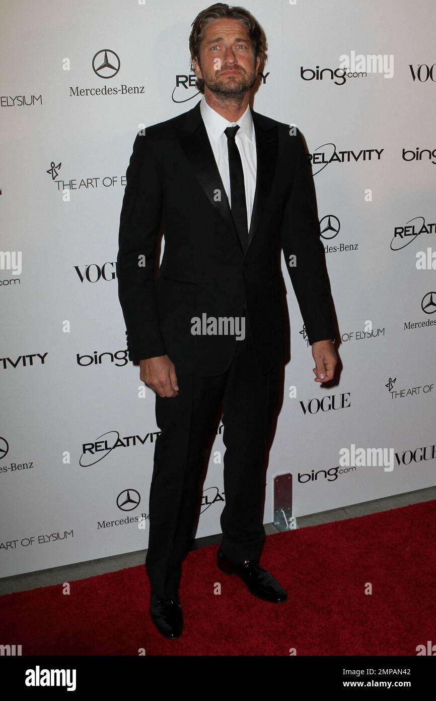 Showing off slicked back hair and a bit of a goatee a tanned and ...