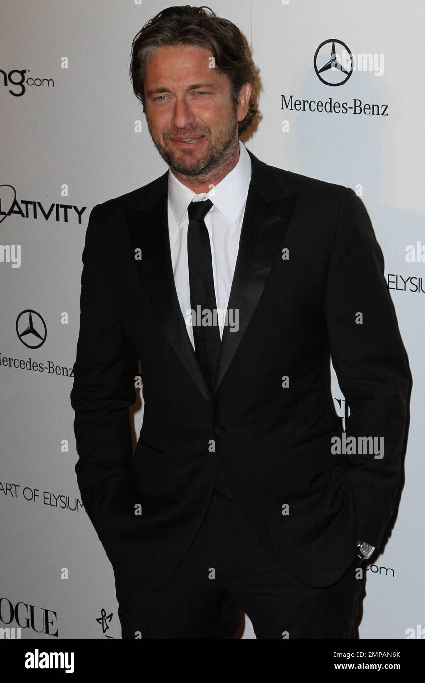 Showing off slicked back hair and a bit of a goatee a tanned and ...