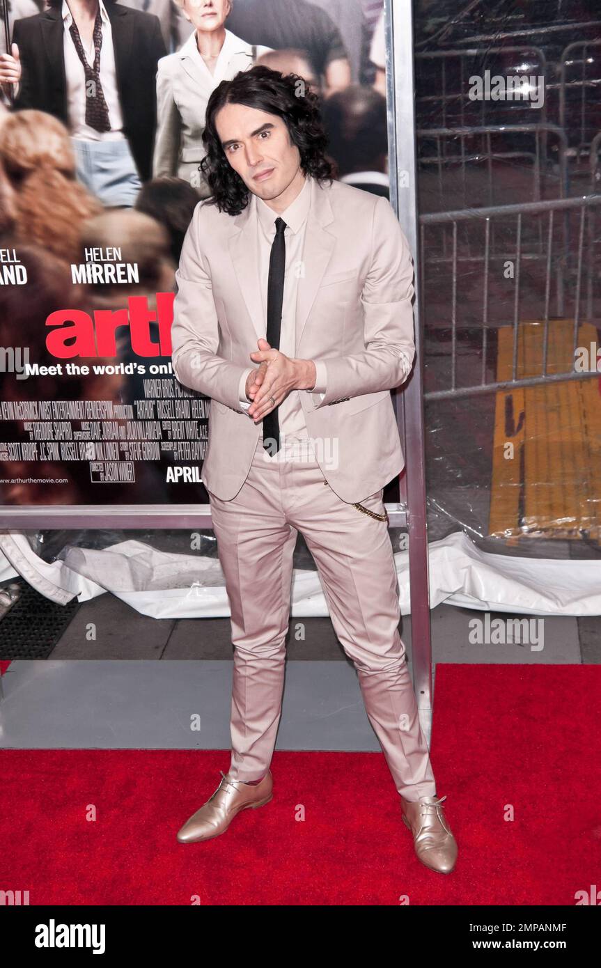 Russell Brand walks the red carpet at the premiere of "Arthur", a ...
