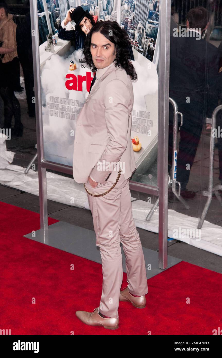 Russell Brand walks the red carpet at the premiere of "Arthur", a ...