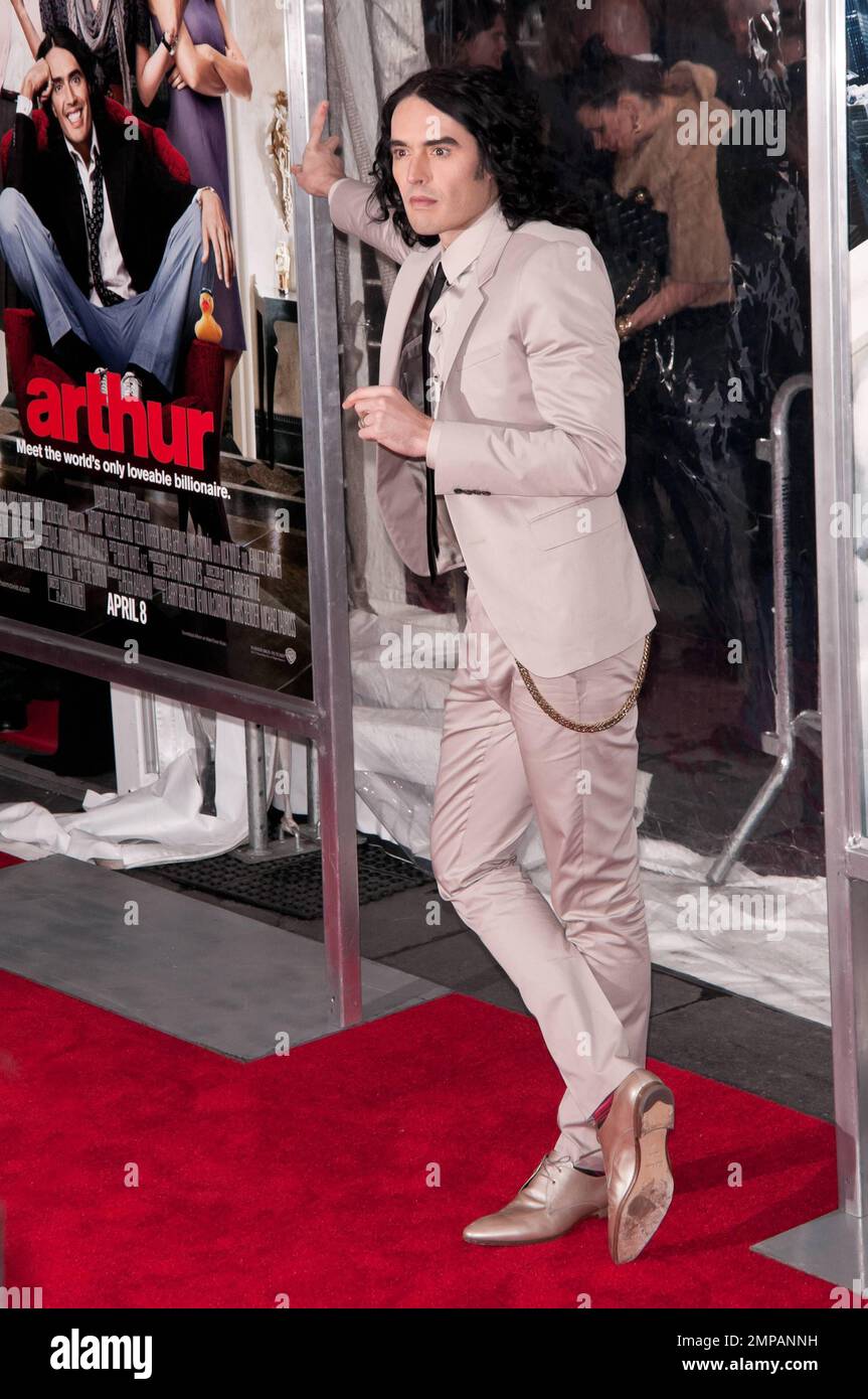 Russell Brand walks the red carpet at the premiere of "Arthur", a ...