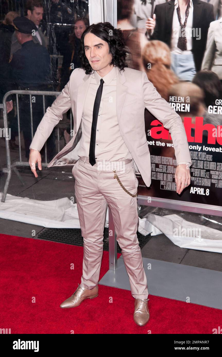 Russell Brand walks the red carpet at the premiere of "Arthur", a ...