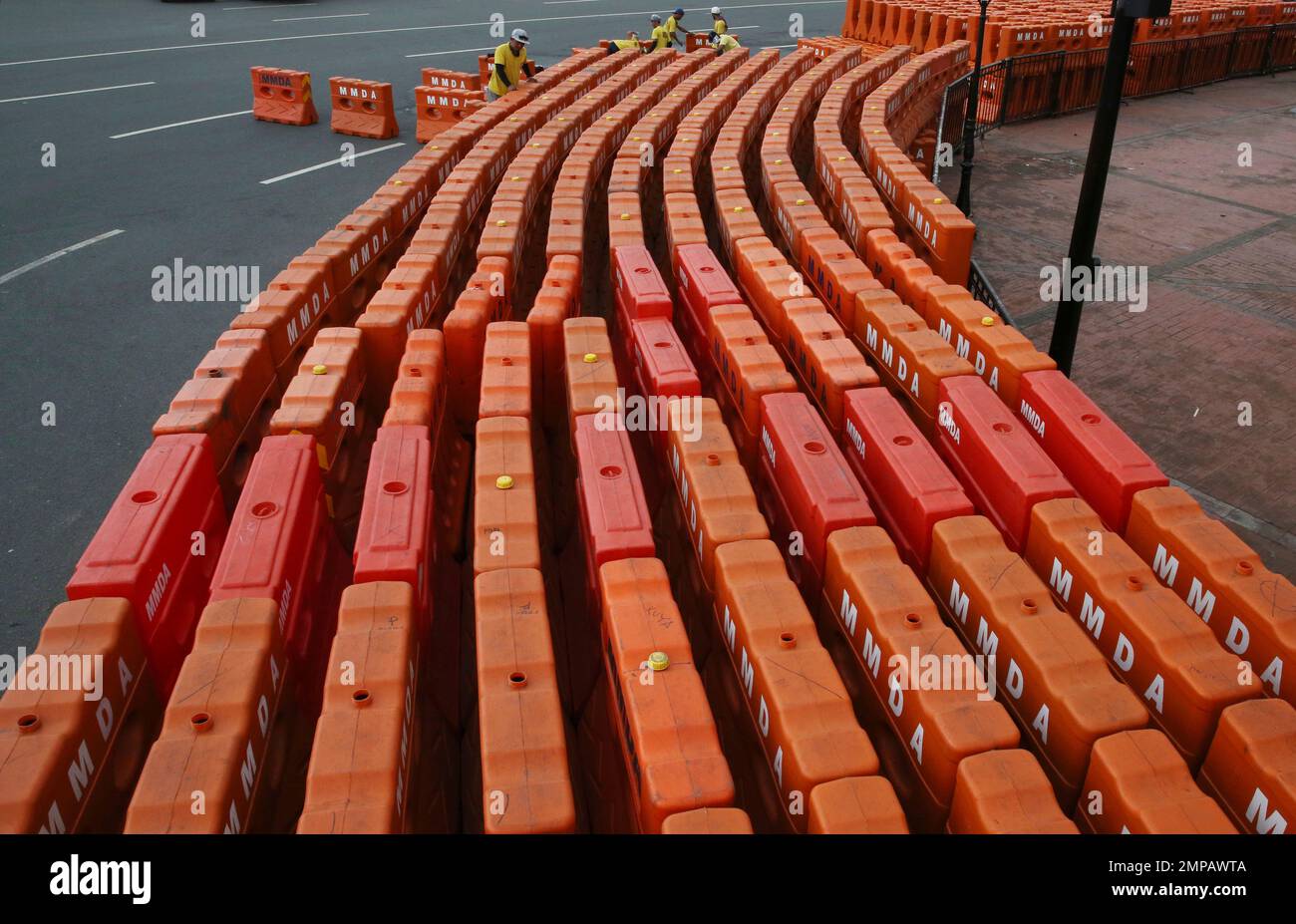 Filipino workers arrange plastic barriers in Manila, Philippines on ...