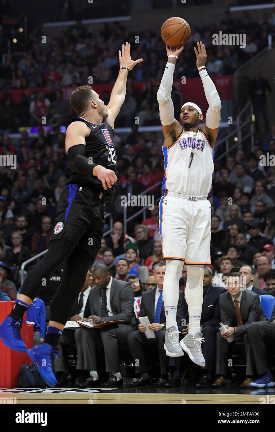 Oklahoma City Thunder forward Carmelo Anthony, right, shoots as Los ...