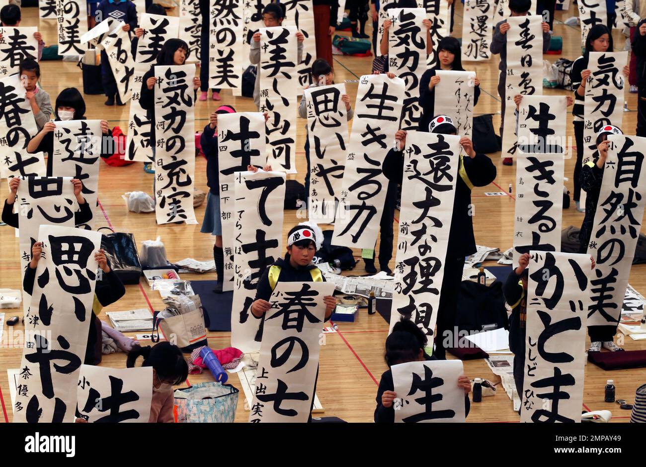 Participants show their writings during the annual New Year's ...
