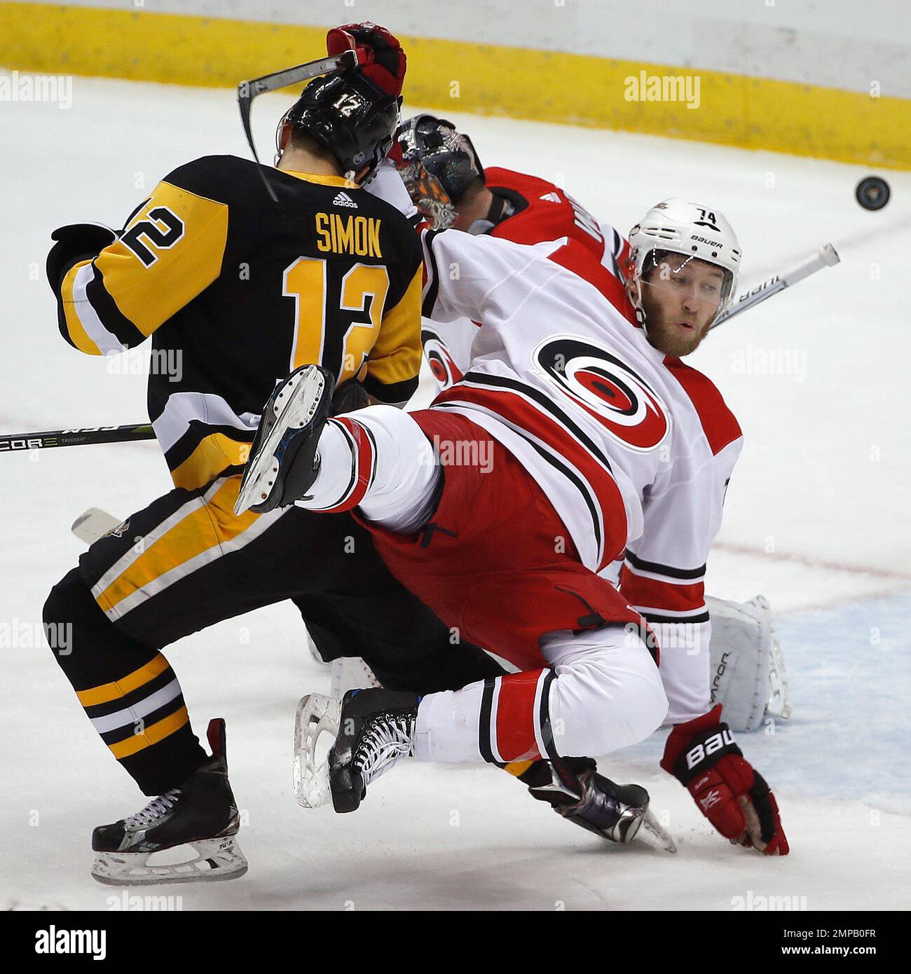 Carolina Hurricanes' Jaccob Slavin (74) collides with Pittsburgh ...