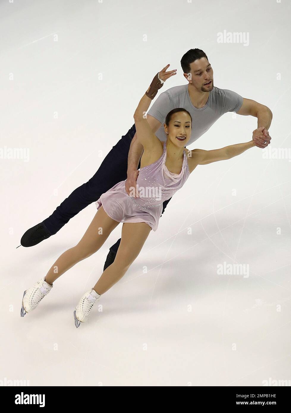Erika Choi Smith, bottom, and AJ Reiss perform during the pairs short ...