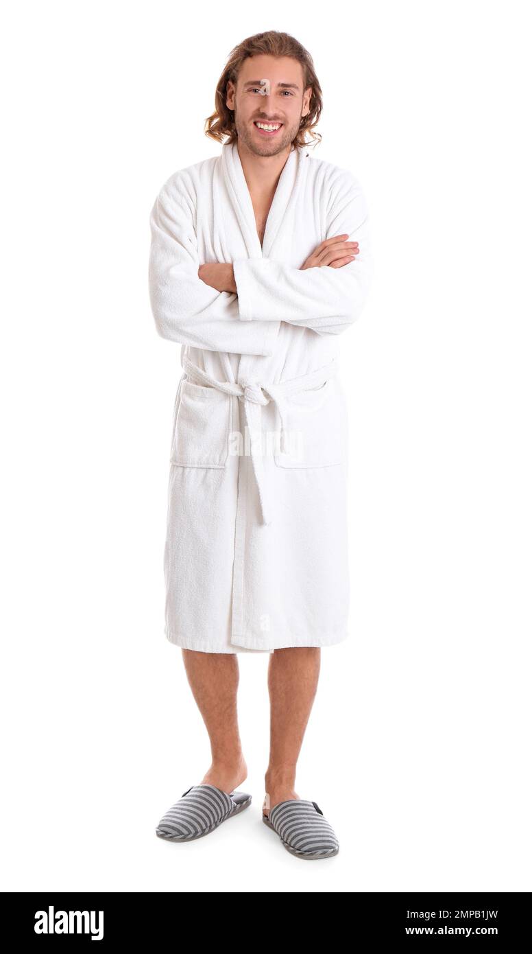 Young man in bathrobe on white background Stock Photo - Alamy