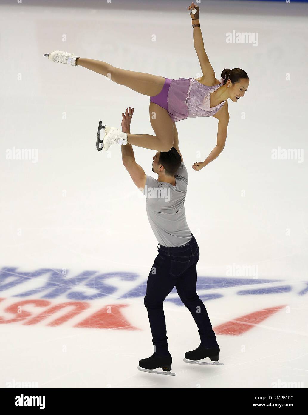 Erika Choi Smith, top, and AJ Reiss perform during the pairs short ...