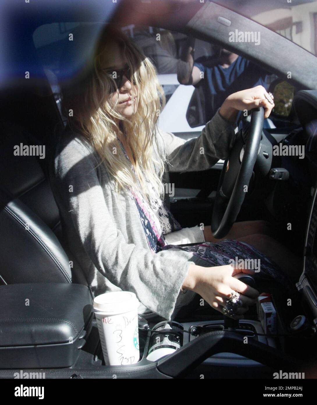Ashley Olsen shops at the boutique store Tracey Ross wearing lots of ...