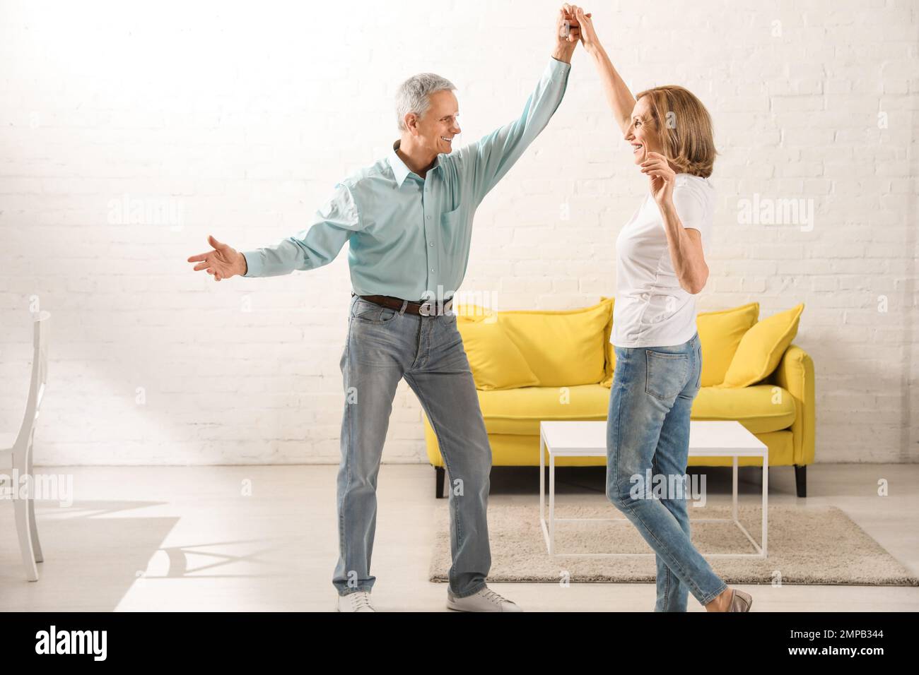 Cute mature couple dancing having hi-res stock photography and images - Alamy