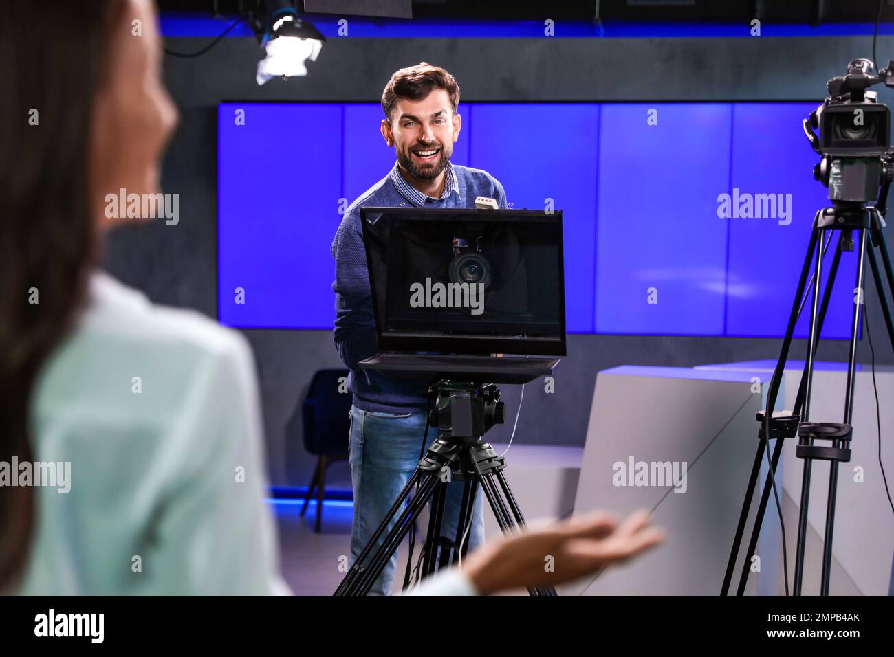 Professional video camera operator working in studio Stock Photo - Alamy