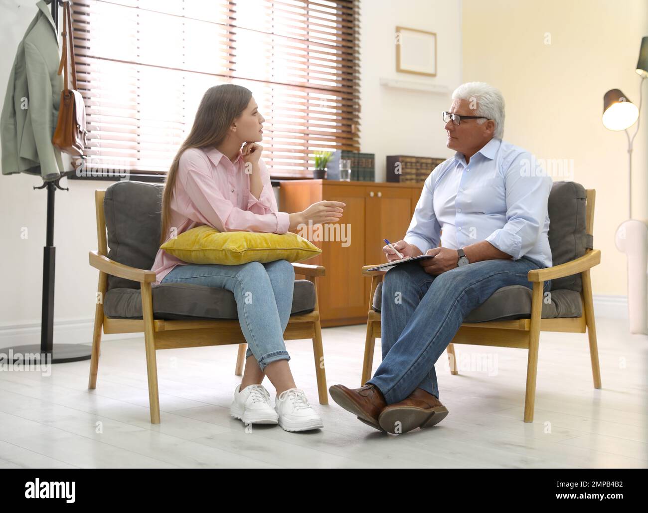 Professional psychotherapist working with patient in office Stock Photo ...