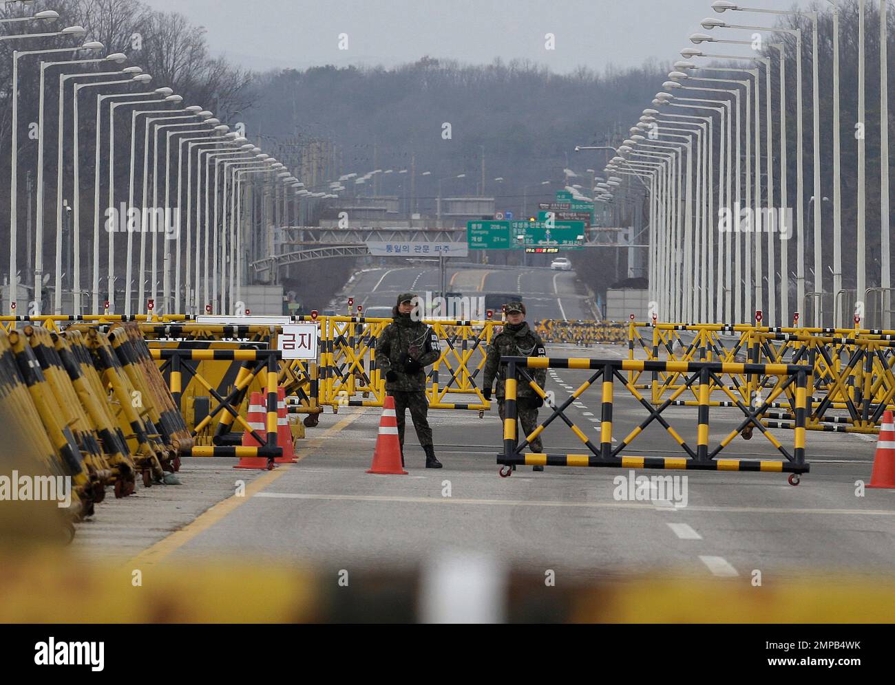 South Korean army soldiers stand guard on Unification Bridge, which ...