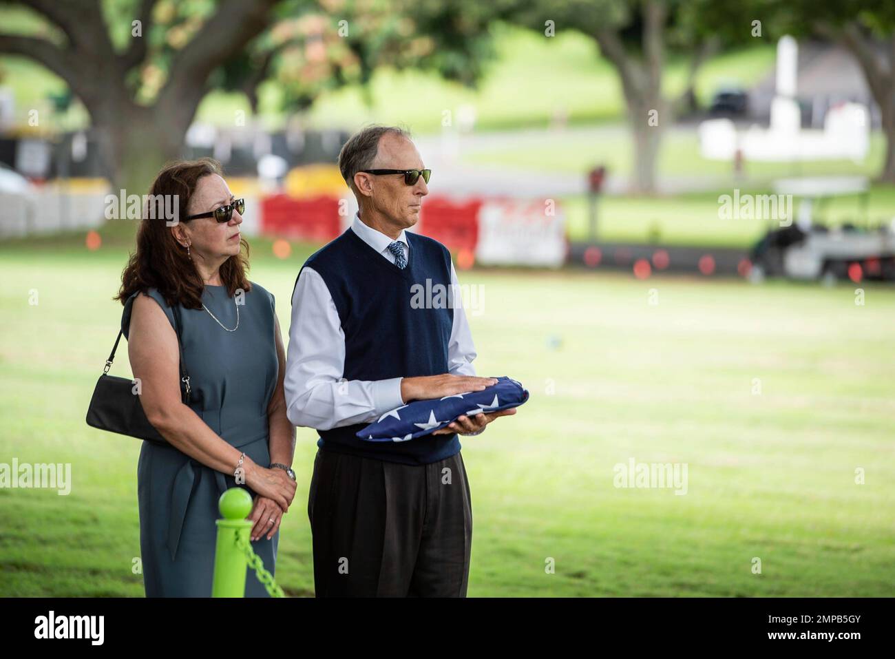 John Basden and his wife, Dolores Basden, watch the lowering of the ...
