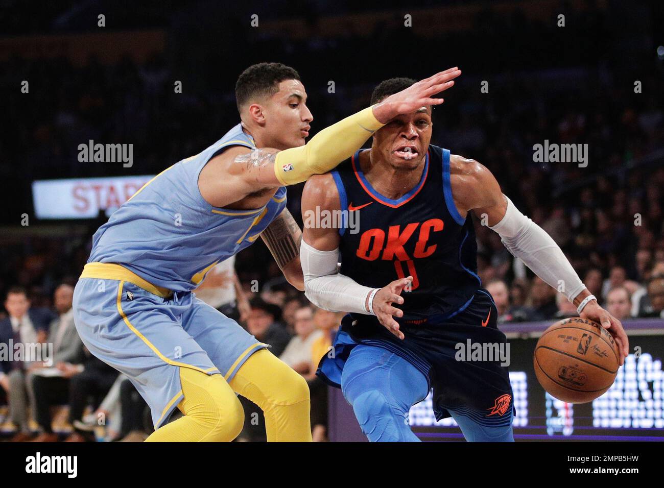 Oklahoma City Thunder's Russell Westbrook, right, drives against Los ...