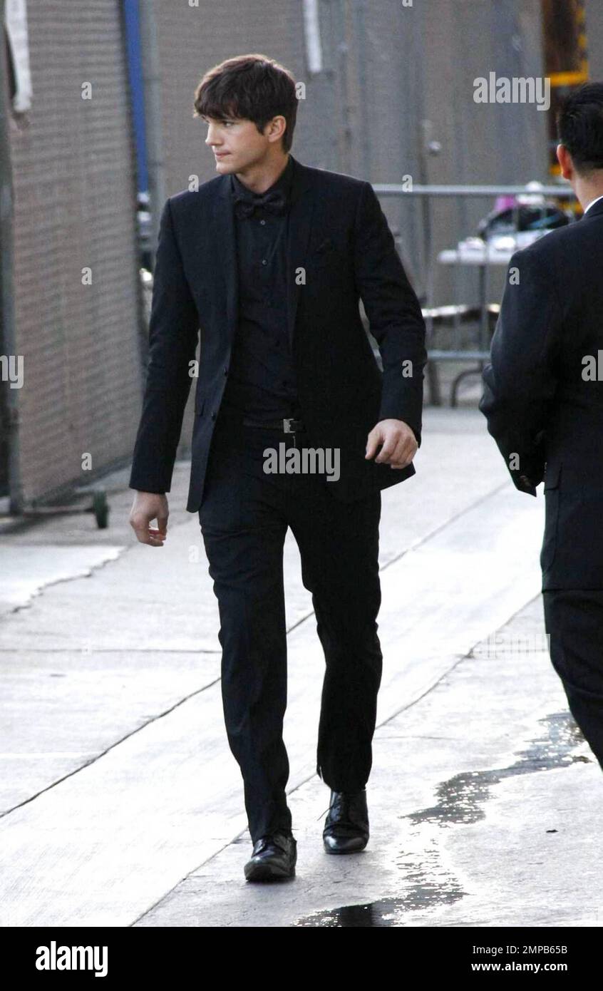 Ashton Kutcher looks dapper in a black suit, shirt and bowtie as he arrives at the "Jimmy Kimmel ...