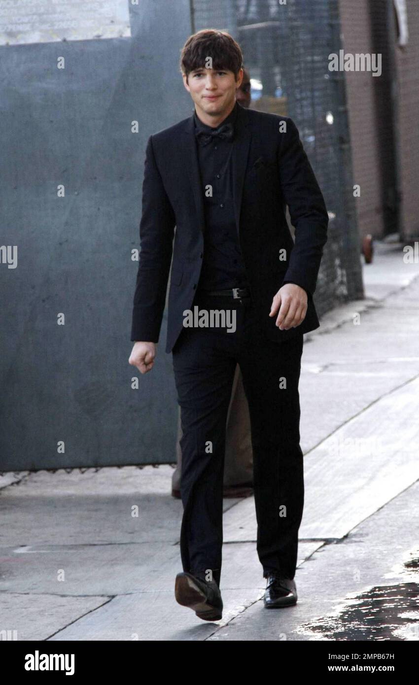 Ashton Kutcher looks dapper in a black suit, shirt and bowtie as he arrives at the "Jimmy Kimmel ...