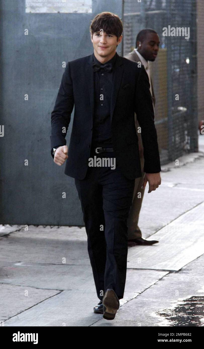 Ashton Kutcher looks dapper in a black suit, shirt and bowtie as he arrives at the "Jimmy Kimmel ...