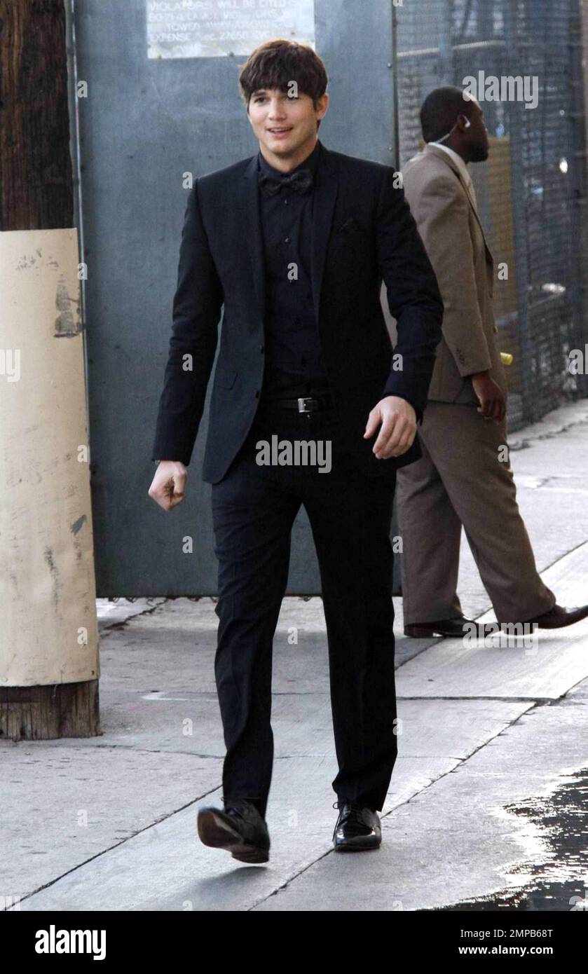 Ashton Kutcher looks dapper in a black suit, shirt and bowtie as he arrives at the "Jimmy Kimmel ...