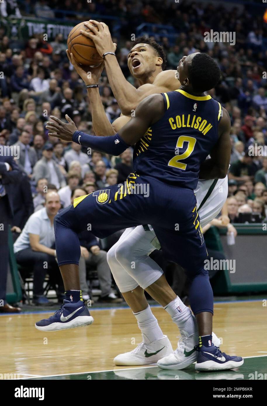 Milwaukee Bucks' Giannis Antetokounmpo is fouled as he drives past ...