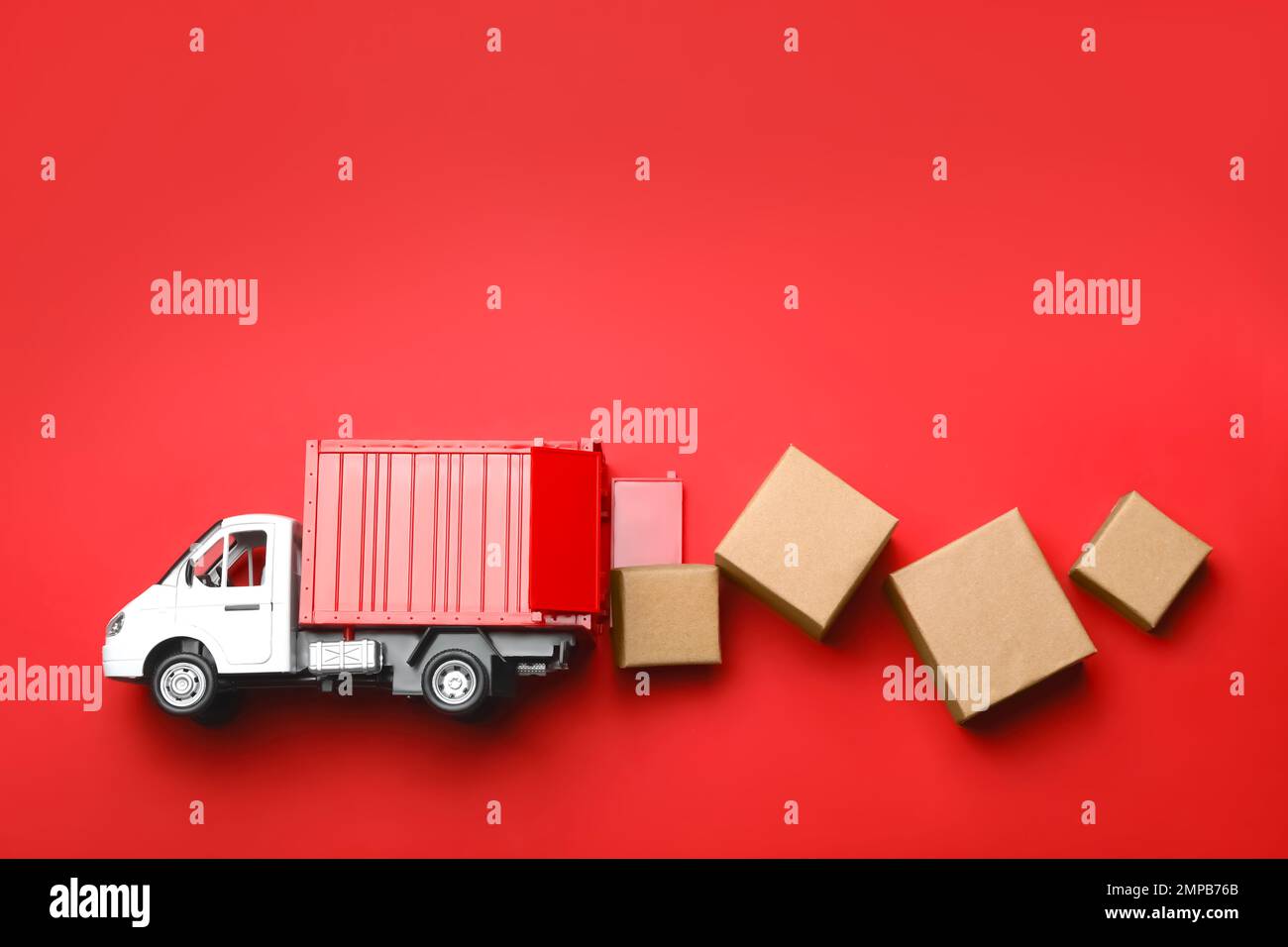 Top view of toy truck with boxes on red background. Logistics and wholesale concept Stock Photo ...