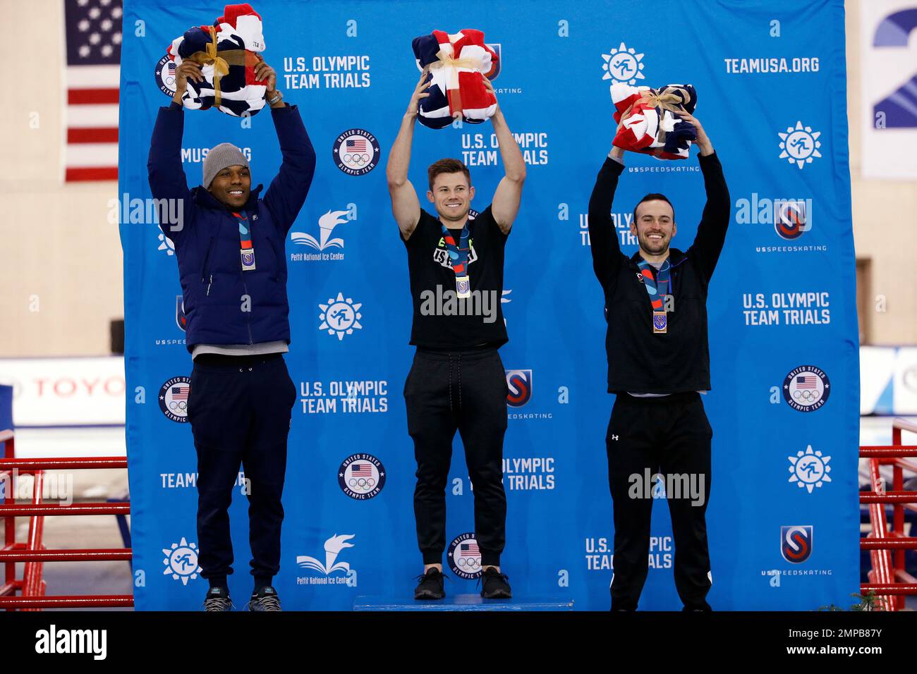 First place finisher Joey Mantia, center, celebrates with second place ...