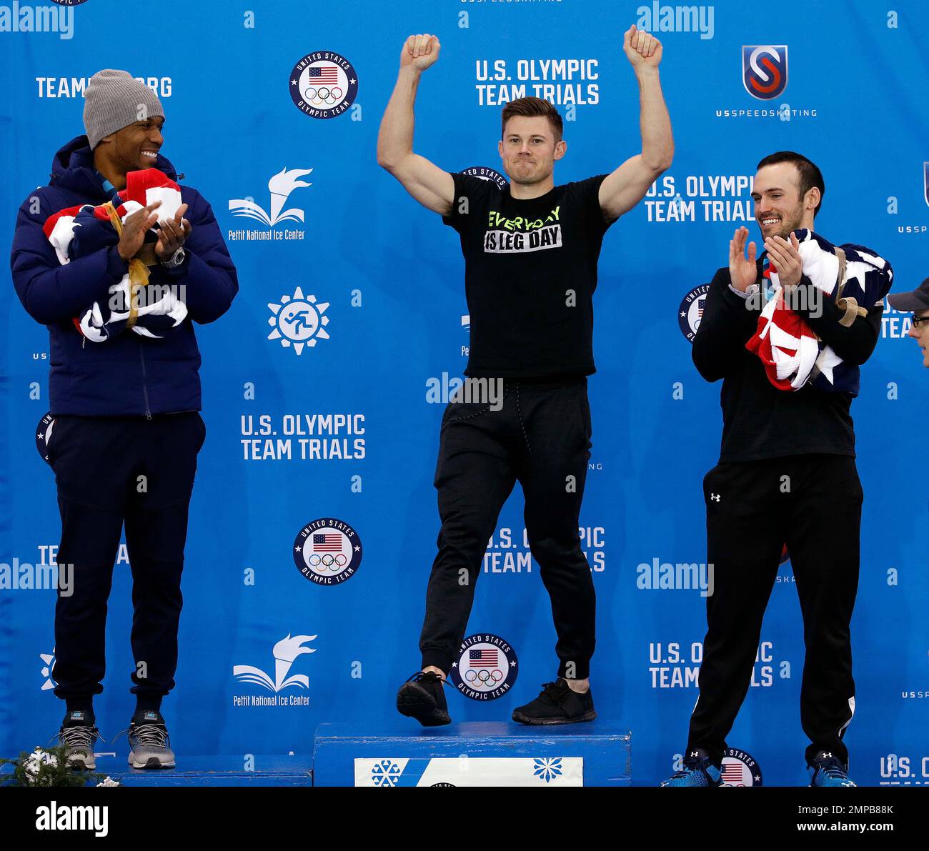 First place finisher Joey Mantia, center, celebrates with second place ...