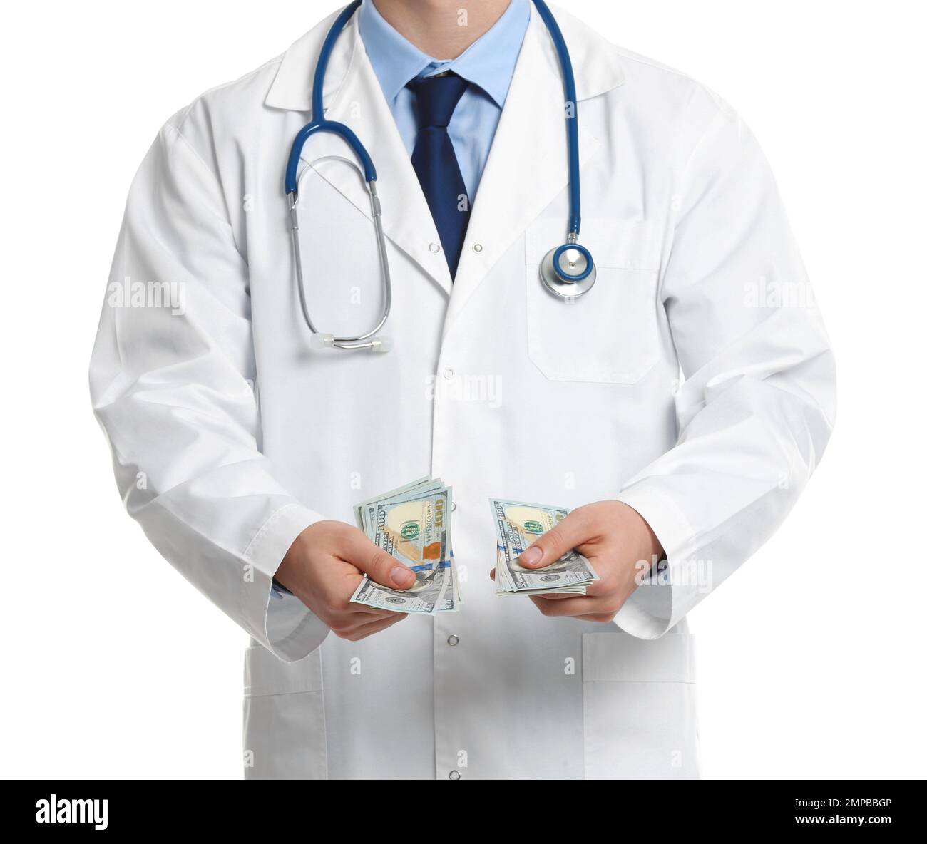 Doctor with bribe on white background, closeup. Corruption in medicine ...