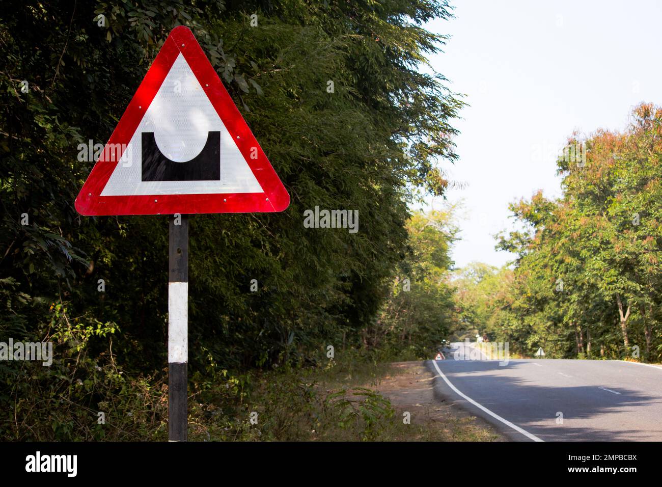 Indian road cautionary sign indicating dip ahead. Sign indicating that ...
