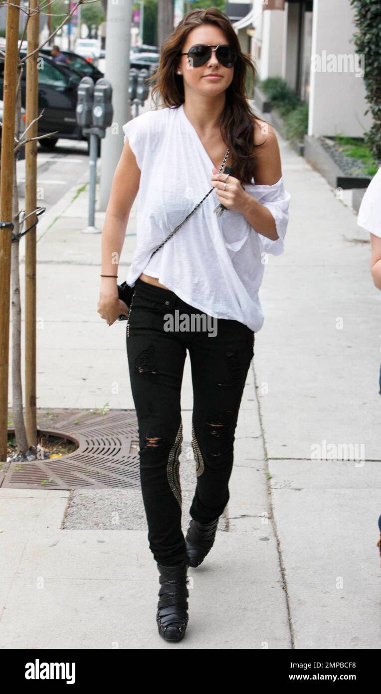 Audrina Patridge dons a trendy off-the-shoulder white tee and ripped ...